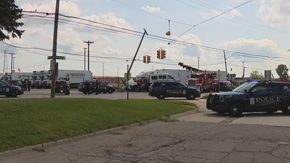 One dead after accident involving a semi and a tow truck